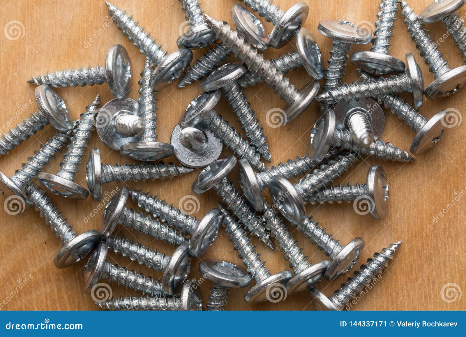 Screws, Lying on a Wooden Table. Carpenter Screws Stock Image - Image ...