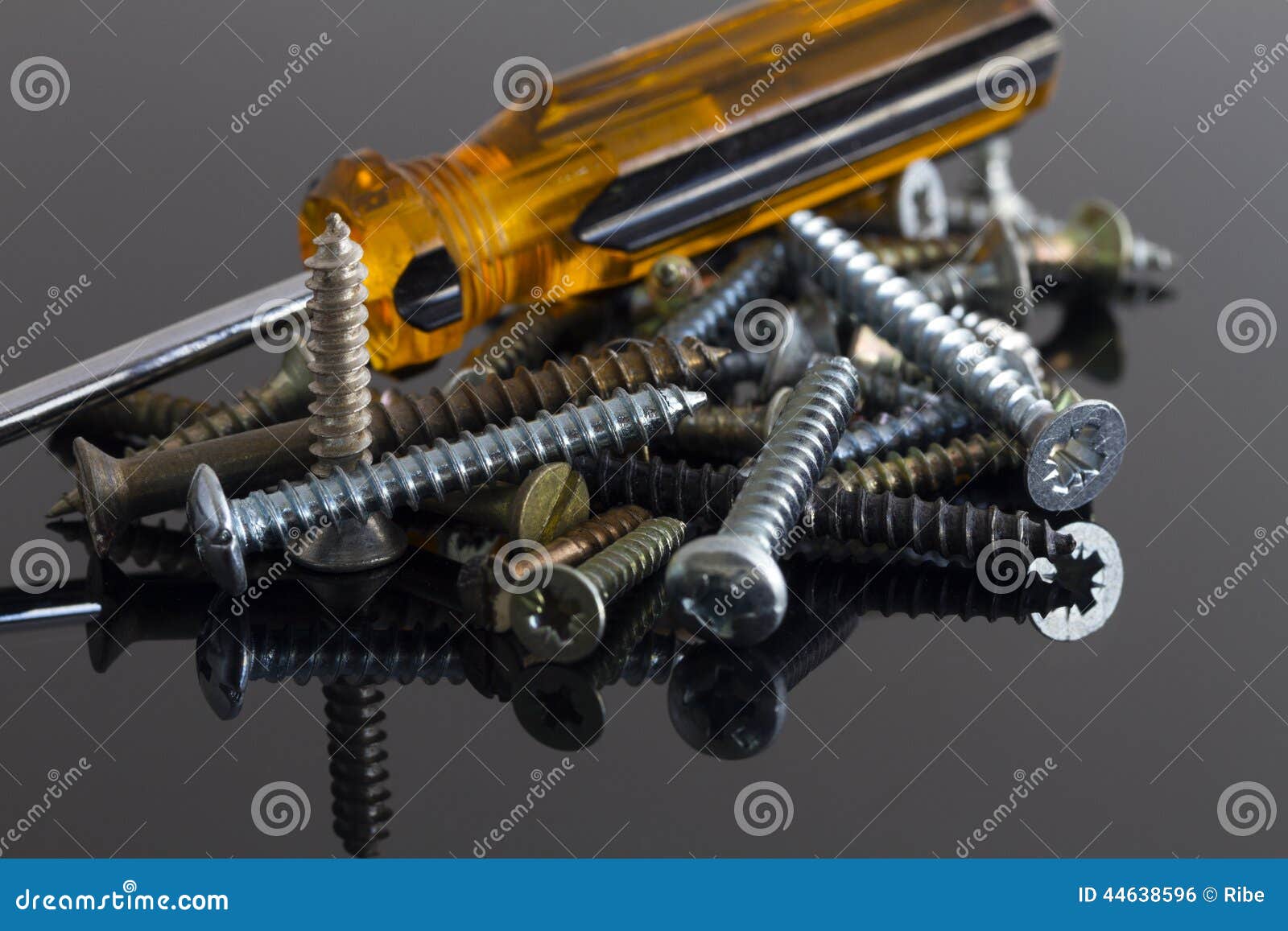 Screws and screwdriver stock photo. Image of steel, ground - 44638596