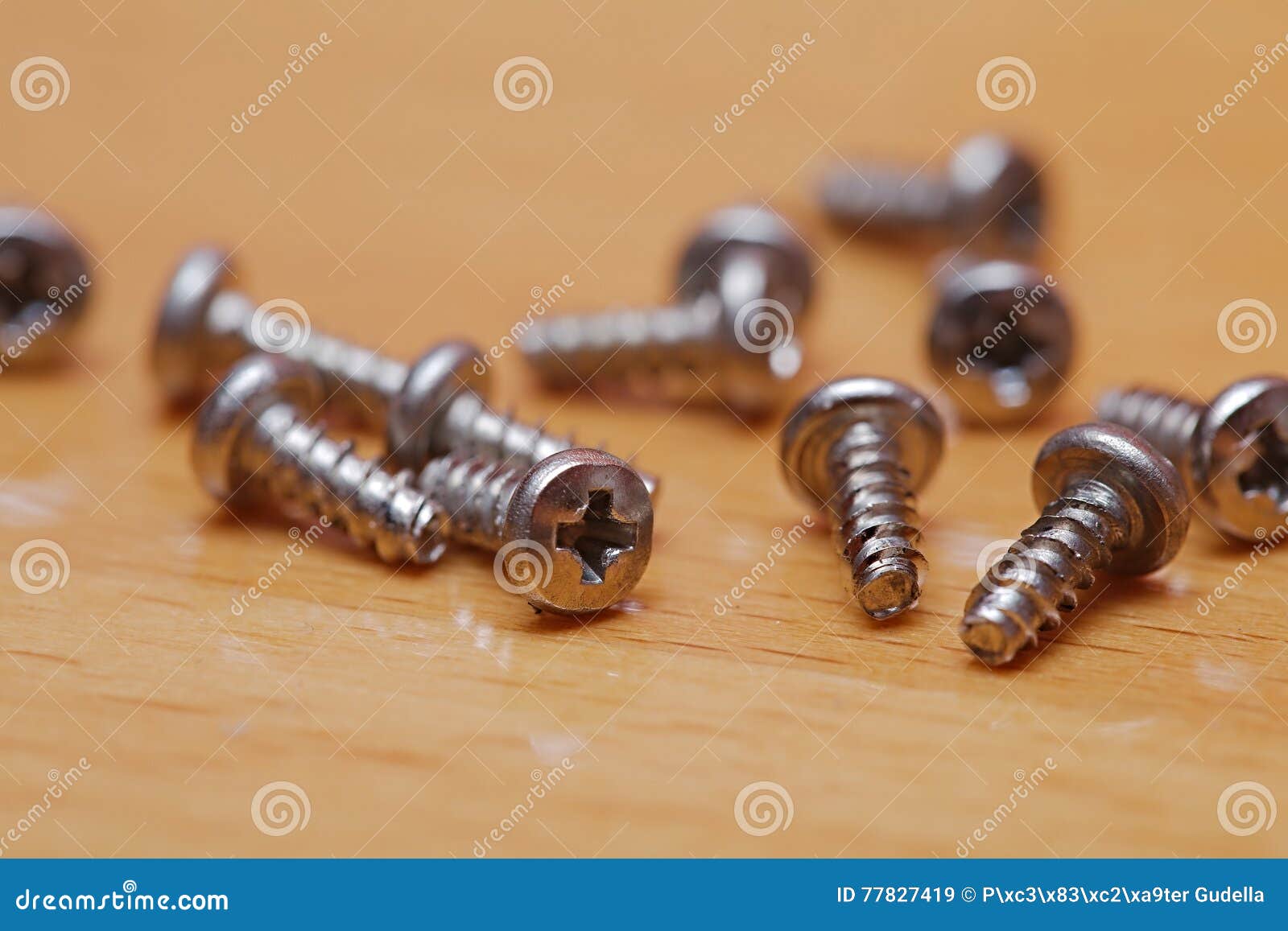 Screws on a table stock image. Image of hardware, component - 77827419