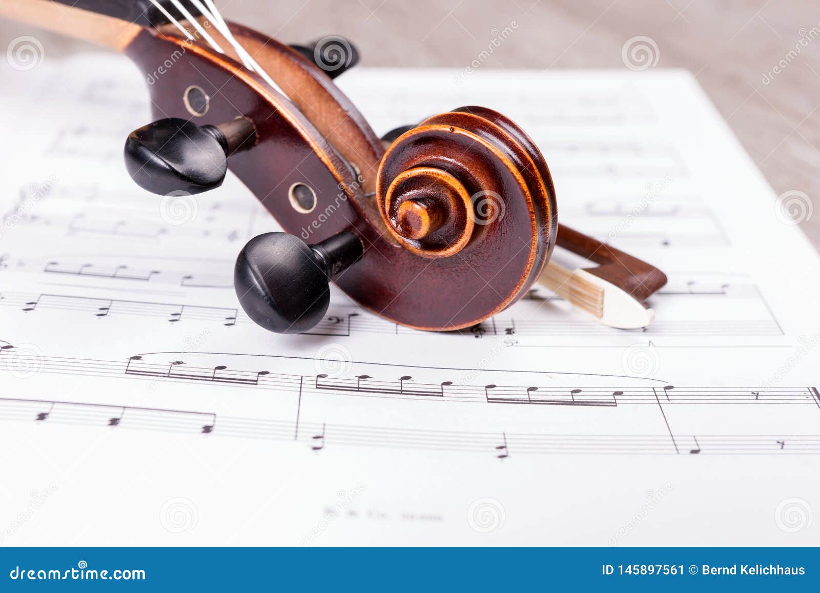 Scroll of the Classical Violin on Music Notes Stock Image - Image of ...