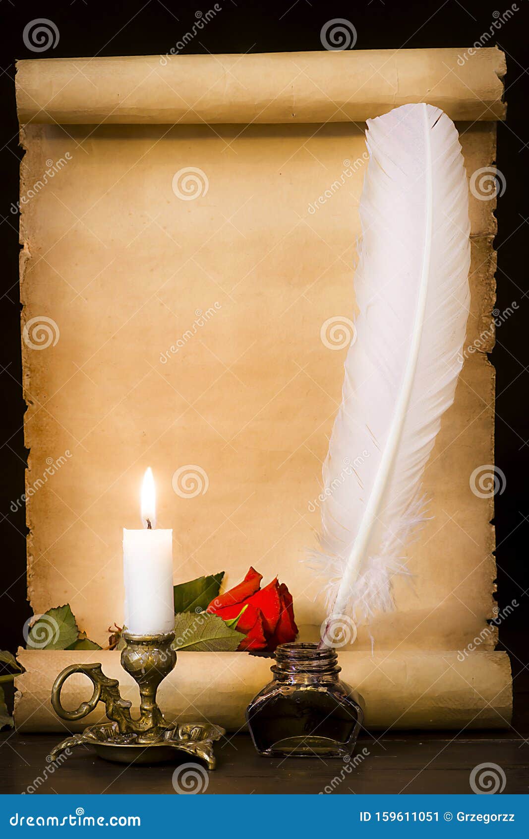 A Scroll of Parchment, a Red Rose, a Feather and a Lit Candle Stock ...
