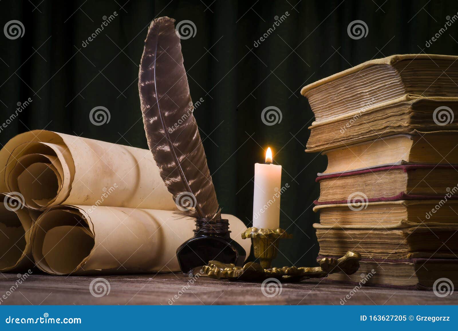 Scrolls of Parchment, a Stack of Books, and a Lit Candle Stock Image ...