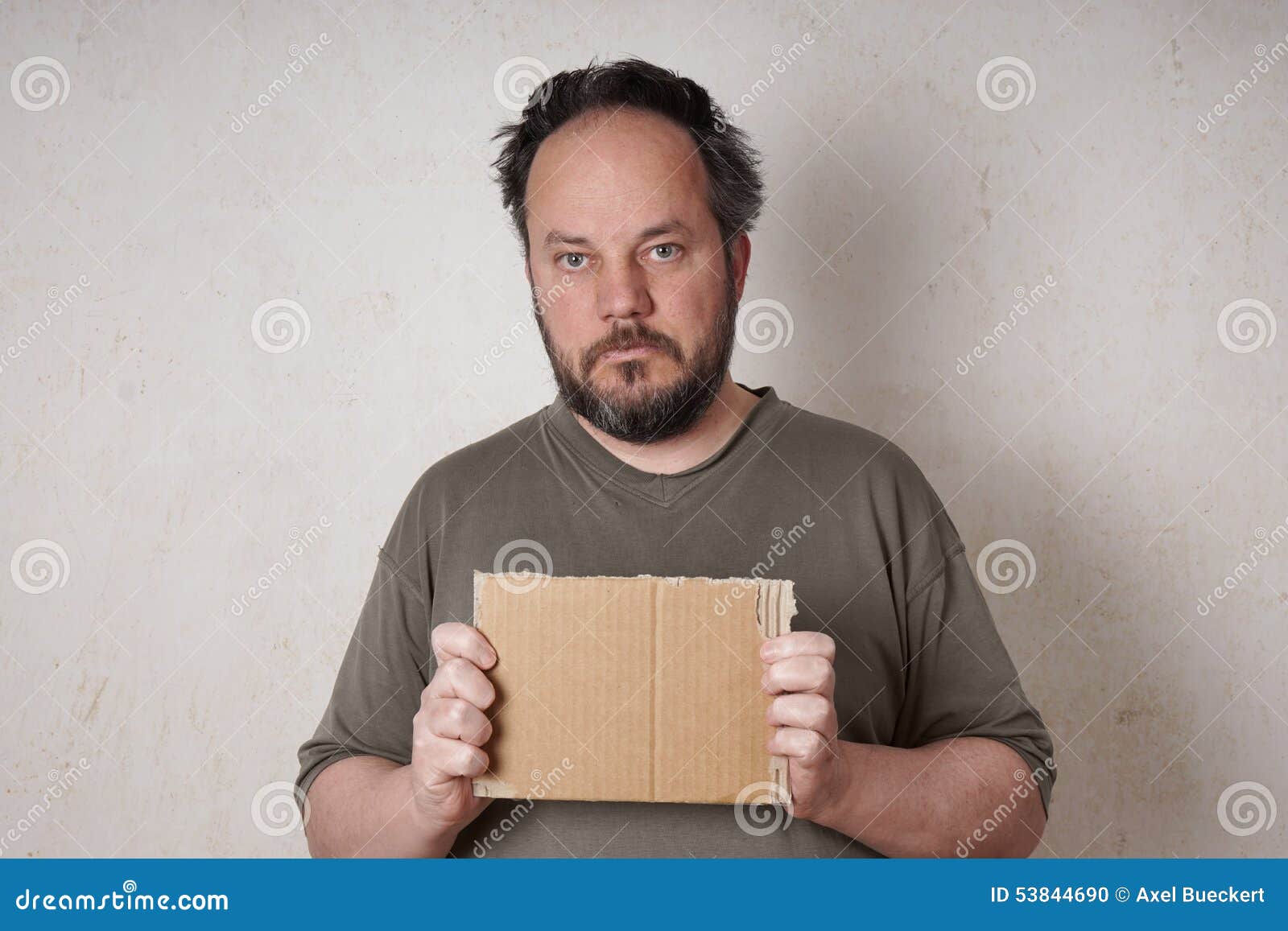 Scruffy man holding sign stock photo. Image of dishevelled - 53844690