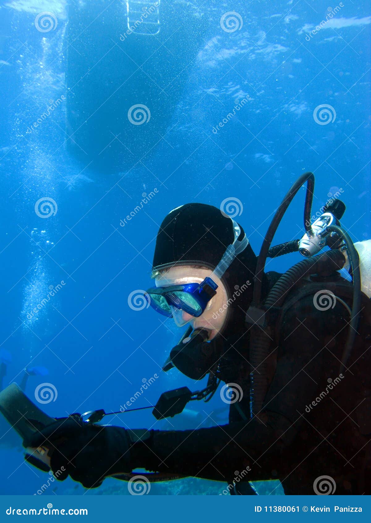 Scuba Diver Checking Gauges Under the Boat Stock Image - Image of ...