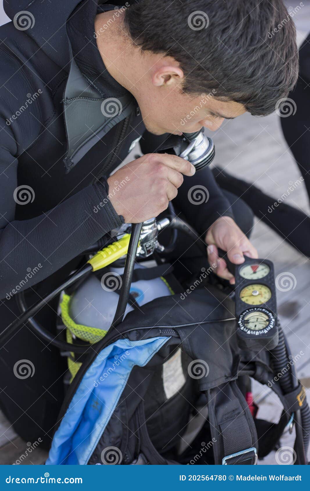 Scuba Diver Kitting Up and Checking His Gear Stock Photo - Image of ...