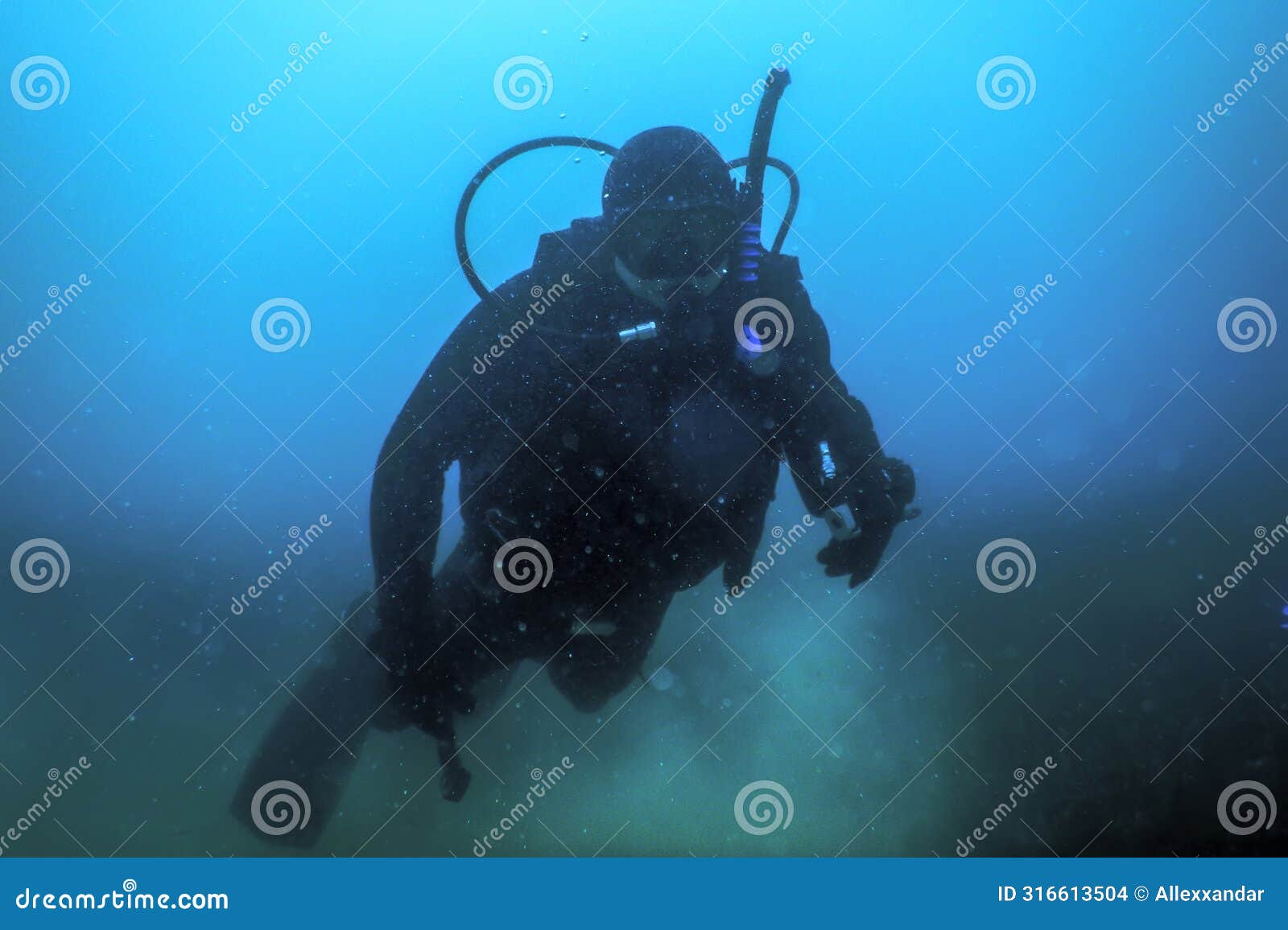 Scuba Diver Swimming on a Blue Water Looking at Camera Stock Photo ...
