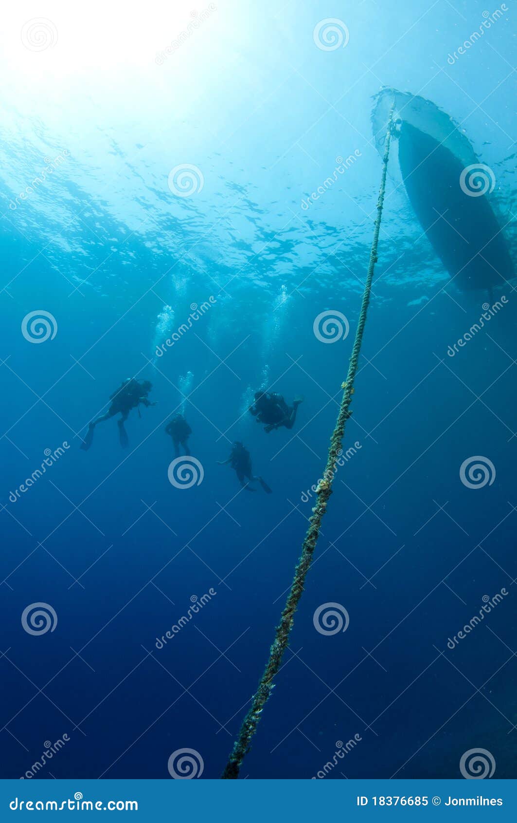 Scuba Divers Dive Together with Boat in Frame Stock Image - Image of ...