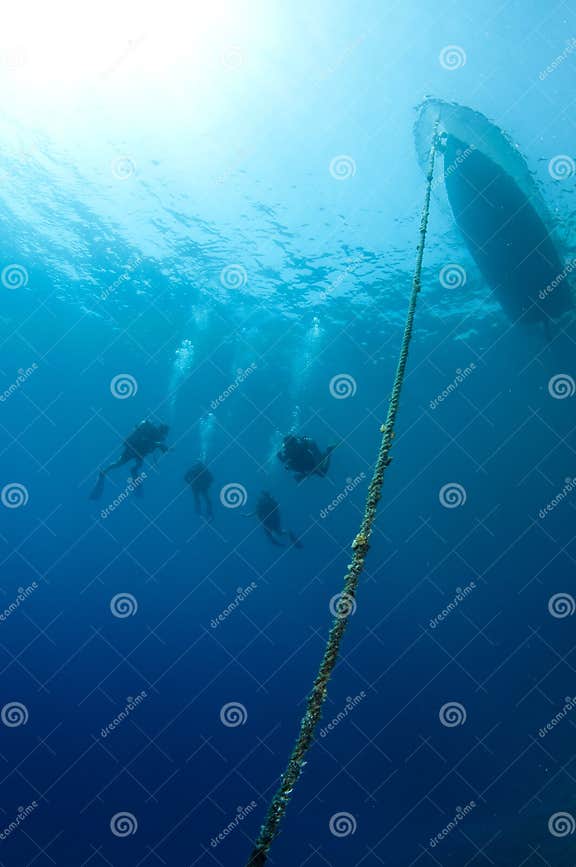Scuba Divers Dive Together with Boat in Frame Stock Image - Image of ...