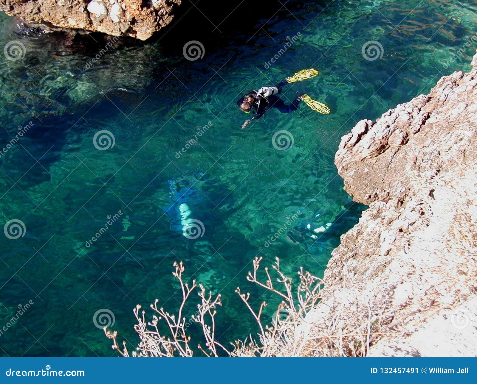Scuba Divers Two Below and One on Surface in the Mediterranean Sea on ...