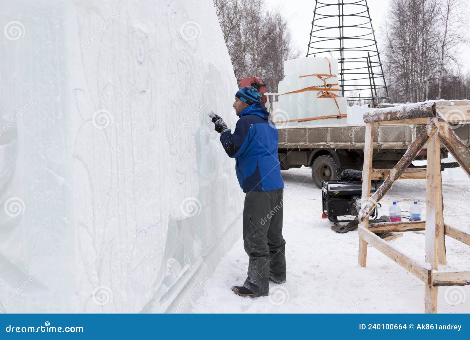 Sculptor in a Blue Winter Suit with a Chisel in His Hands at Work Stock ...