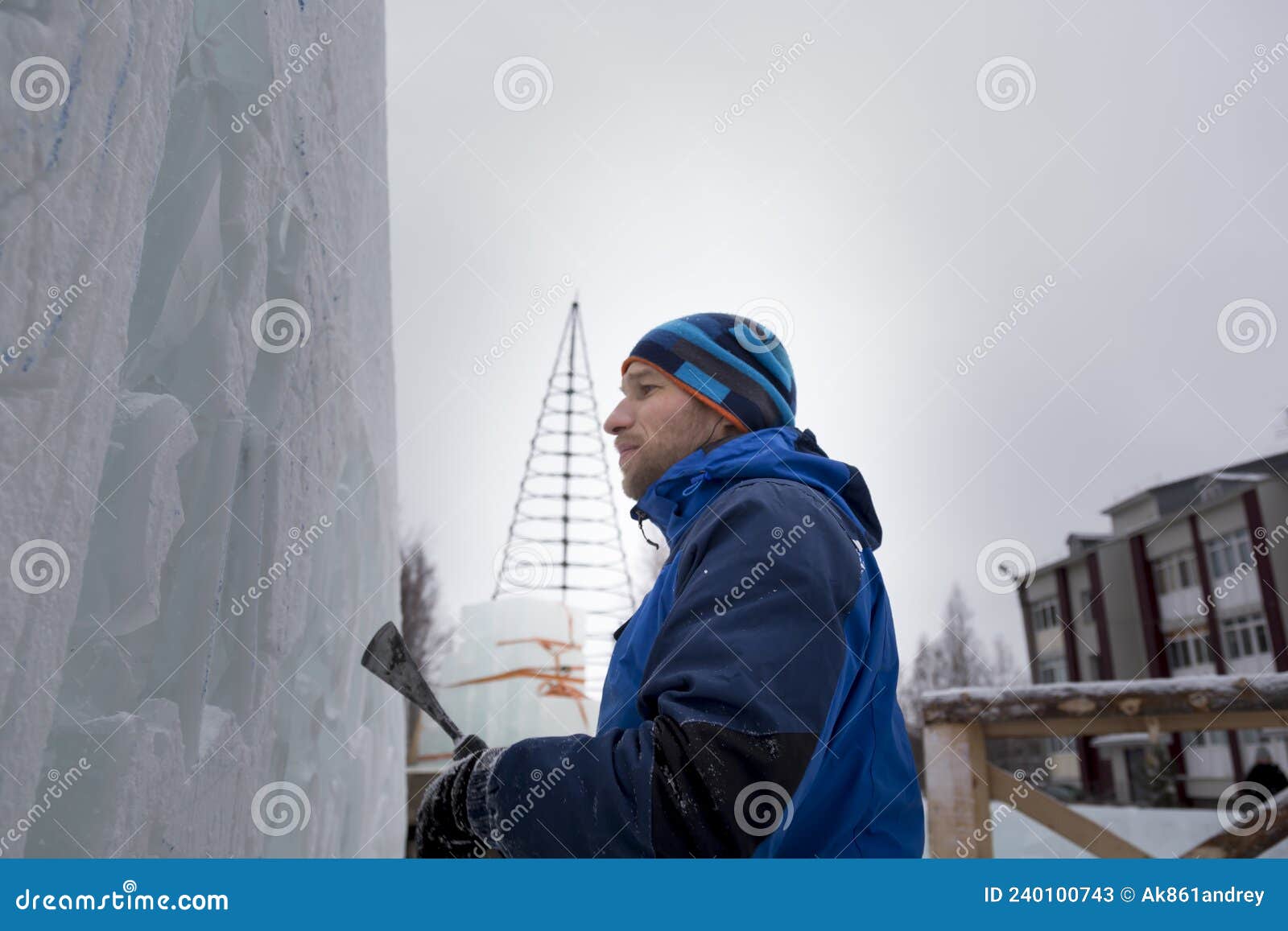 Sculptor in a Blue Winter Suit with a Chisel in His Hands at Work Stock ...