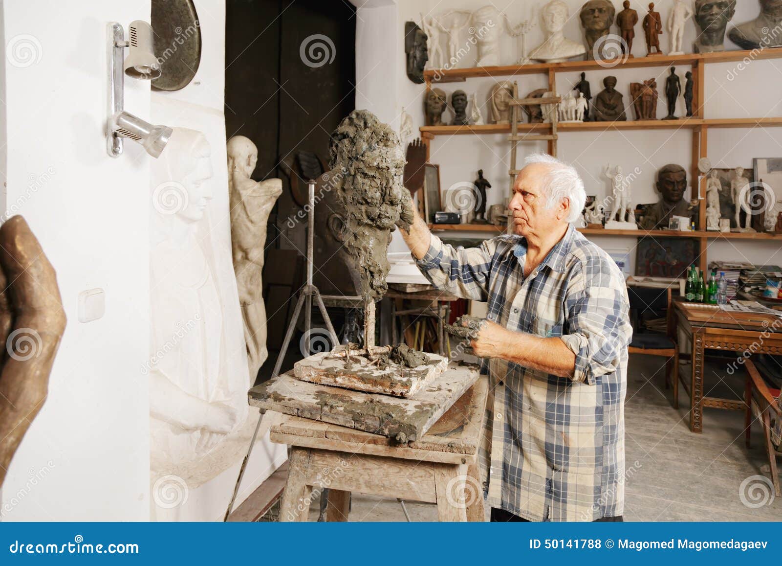 Sculptor Creates A Bust And Puts His Hands Clay On The Skeleton Of The ...