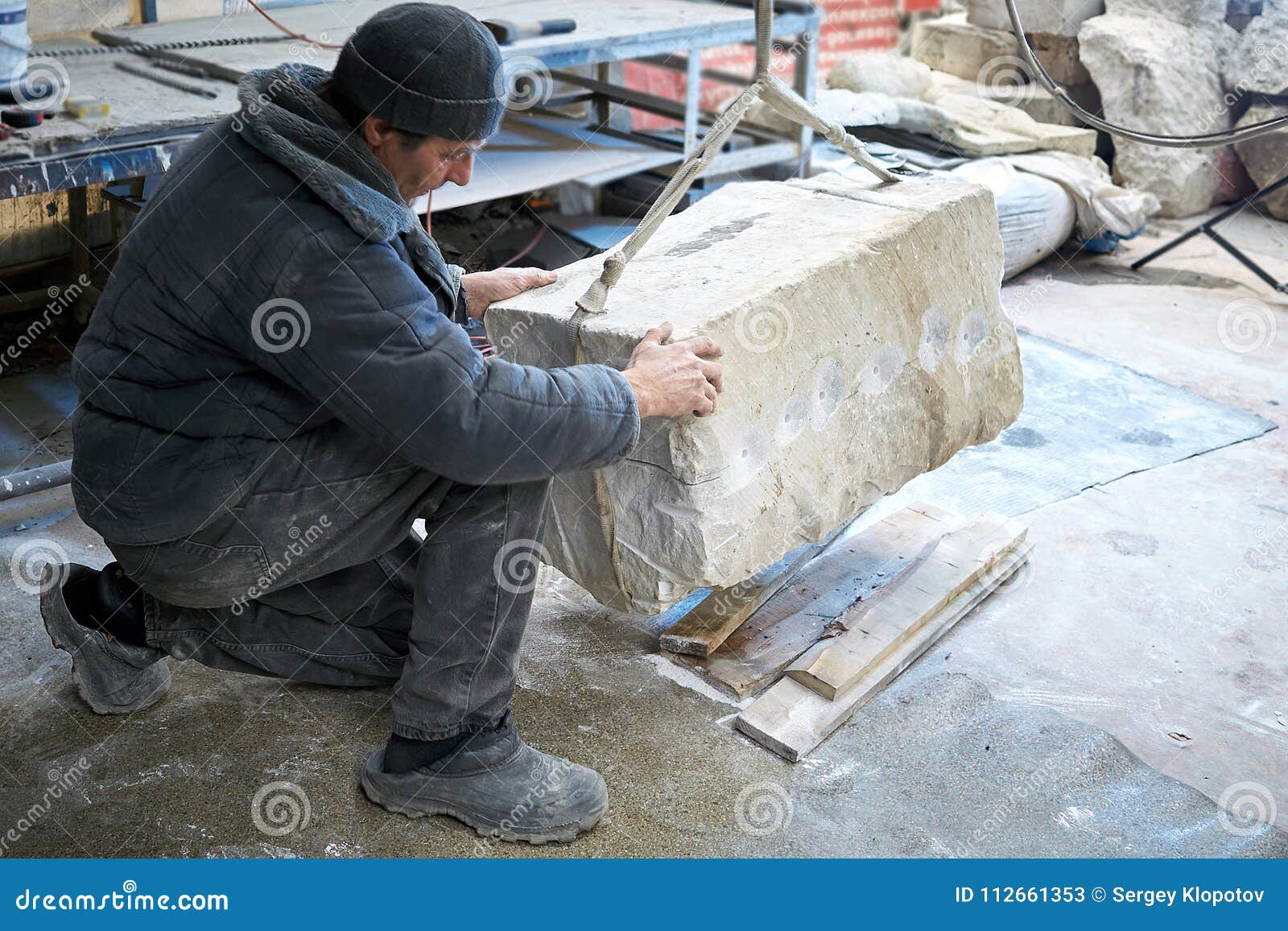 Sculptor Gem-worker Lifts a Crane a Piece of Marble. Stock Image ...