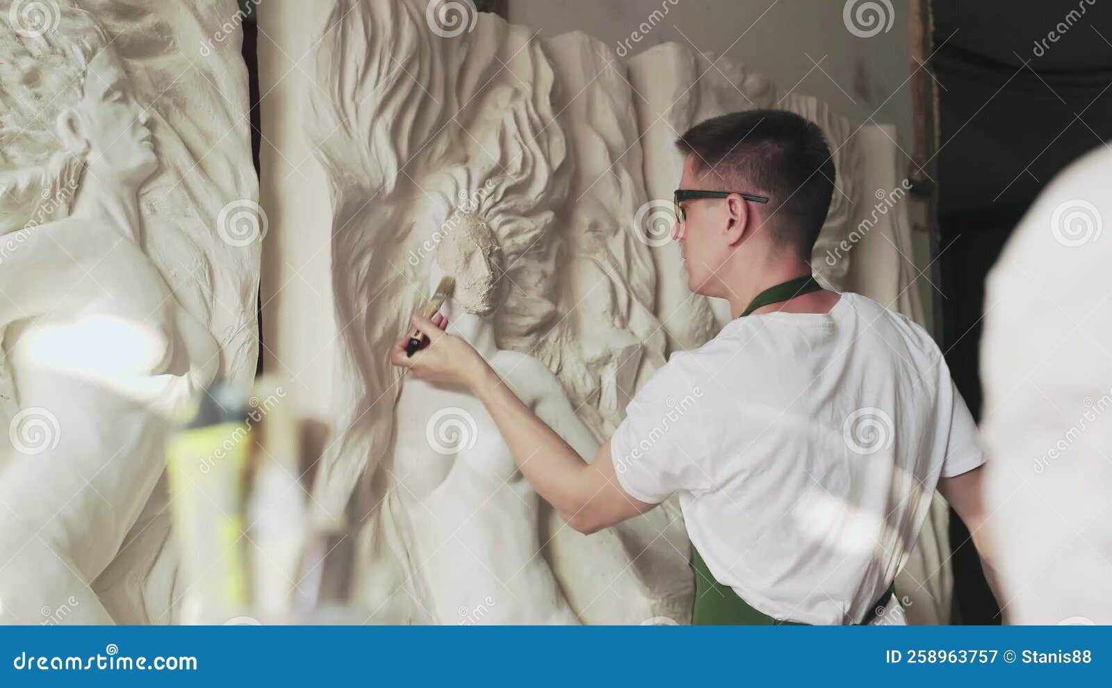Sculptor Work with Plaster Structural Composition on the Wall of Women ...