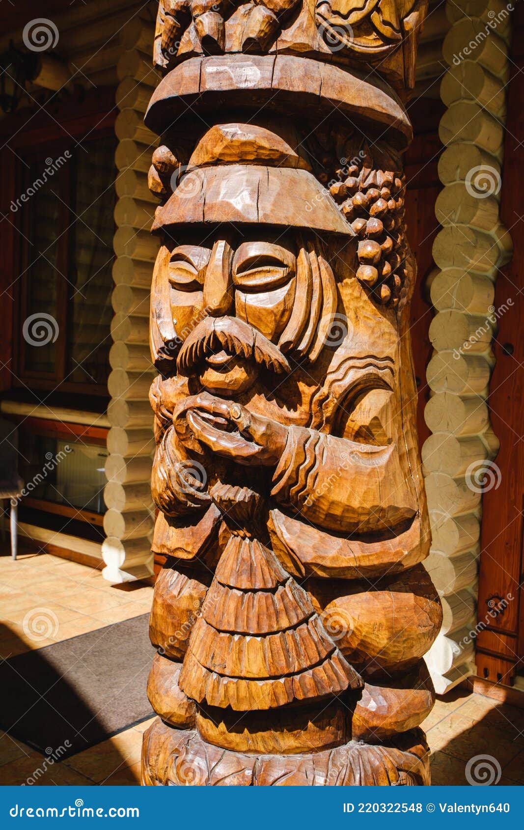 A Sculpture of an Ancient God Carved Out of Wood. Stock Photo - Image ...
