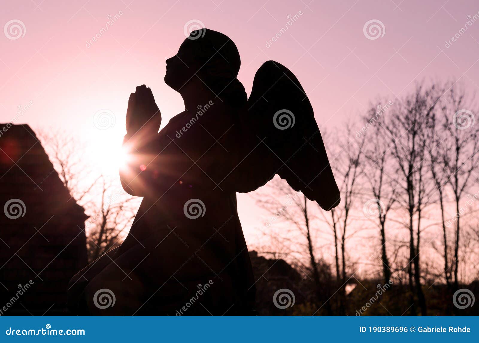 Sculpture of an Angel in the Sunset Stock Photo - Image of light ...