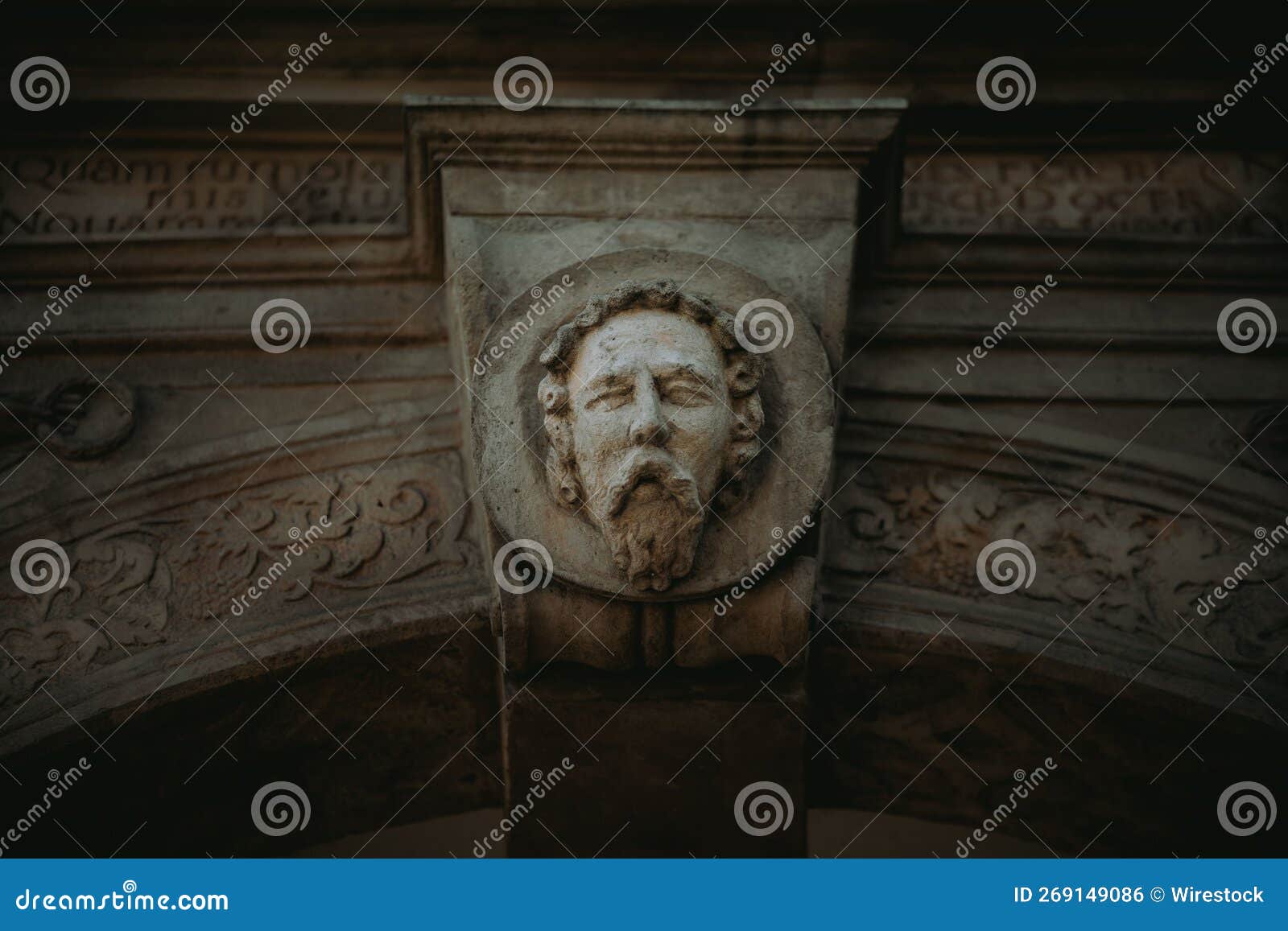 Sculpture of a Human Face on the Wall Stock Photo - Image of ...