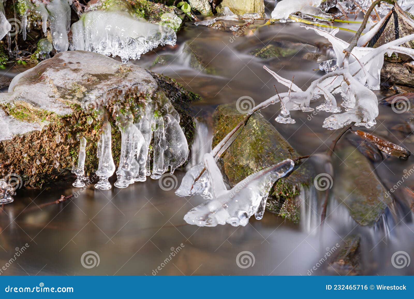 Sculptures of Ice Hanging Over a Waterfall Stock Photo - Image of ...