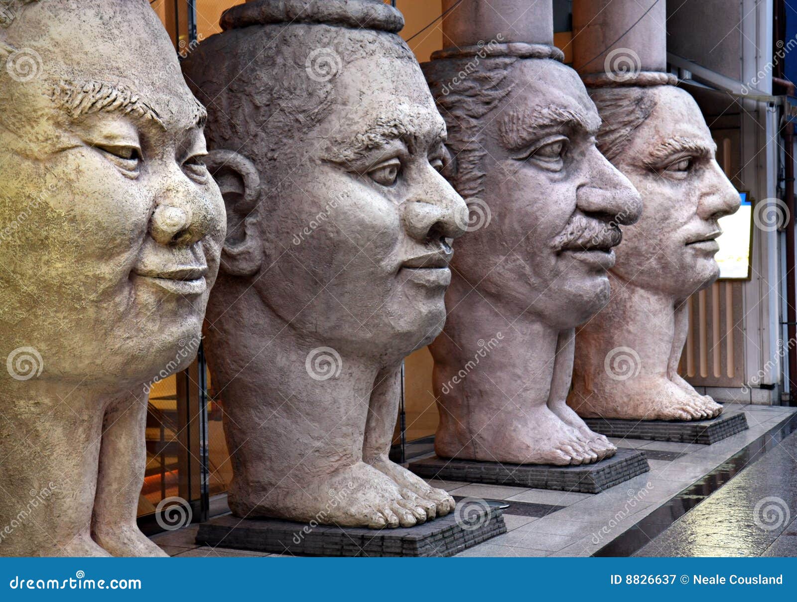 Scupture of 4 faces stock image. Image of global, african - 8826637