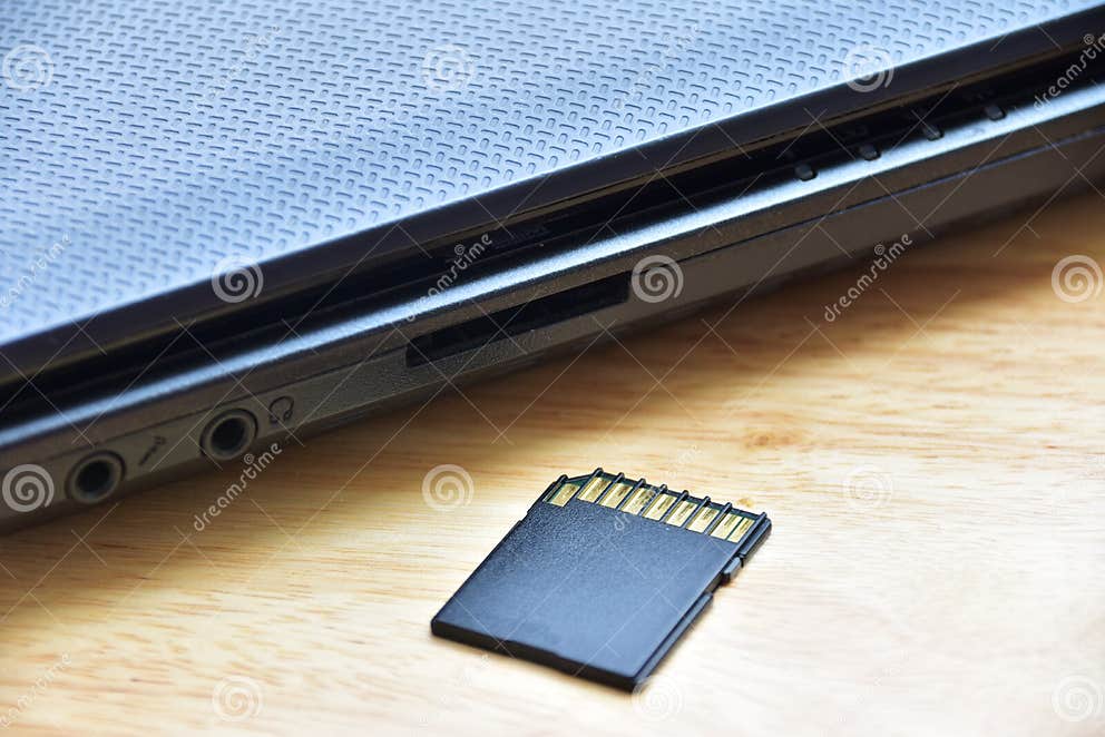 Sd Card in Slot with Computer Notebook. Stock Photo - Image of ...