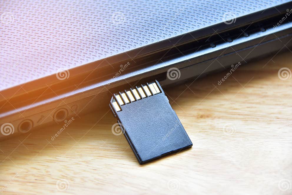 Sd Card in Slot with Computer Notebook. Stock Photo - Image of small ...