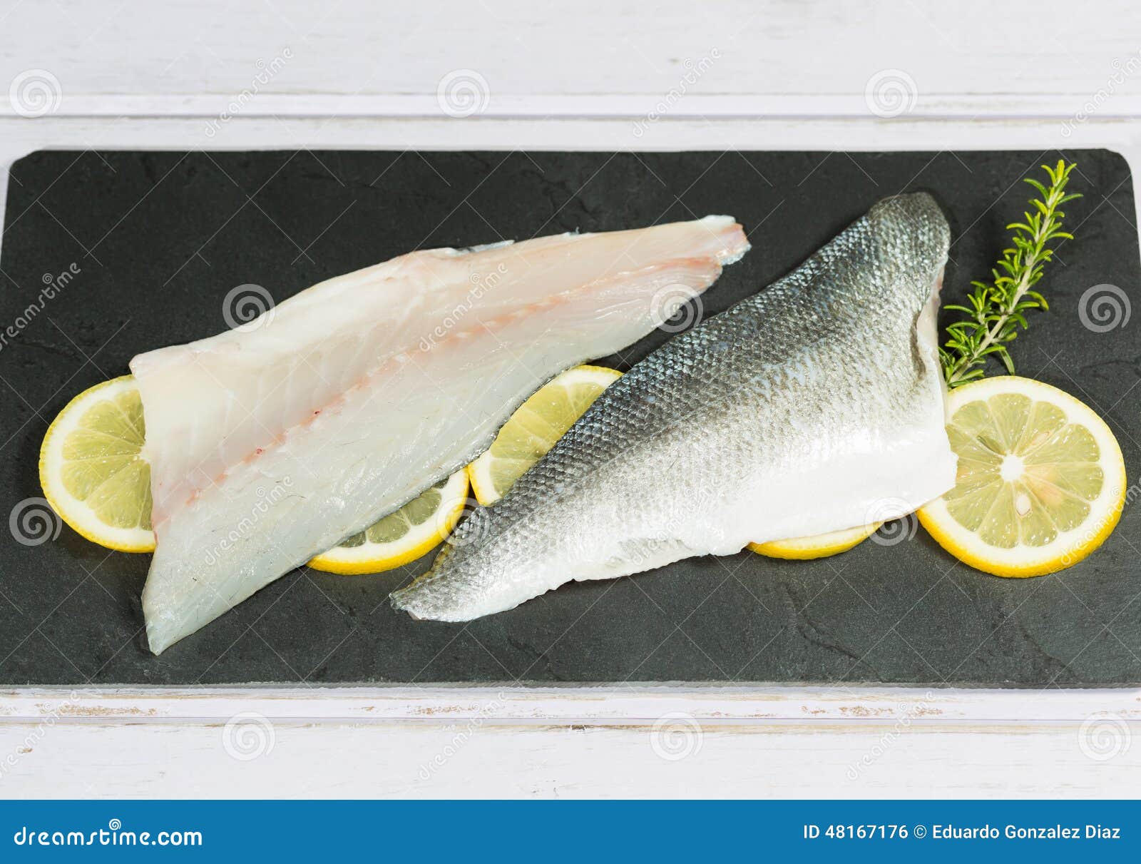 Raw Sea Bass Fillets With Cherry Tomatoes Royalty-Free Stock Photo ...