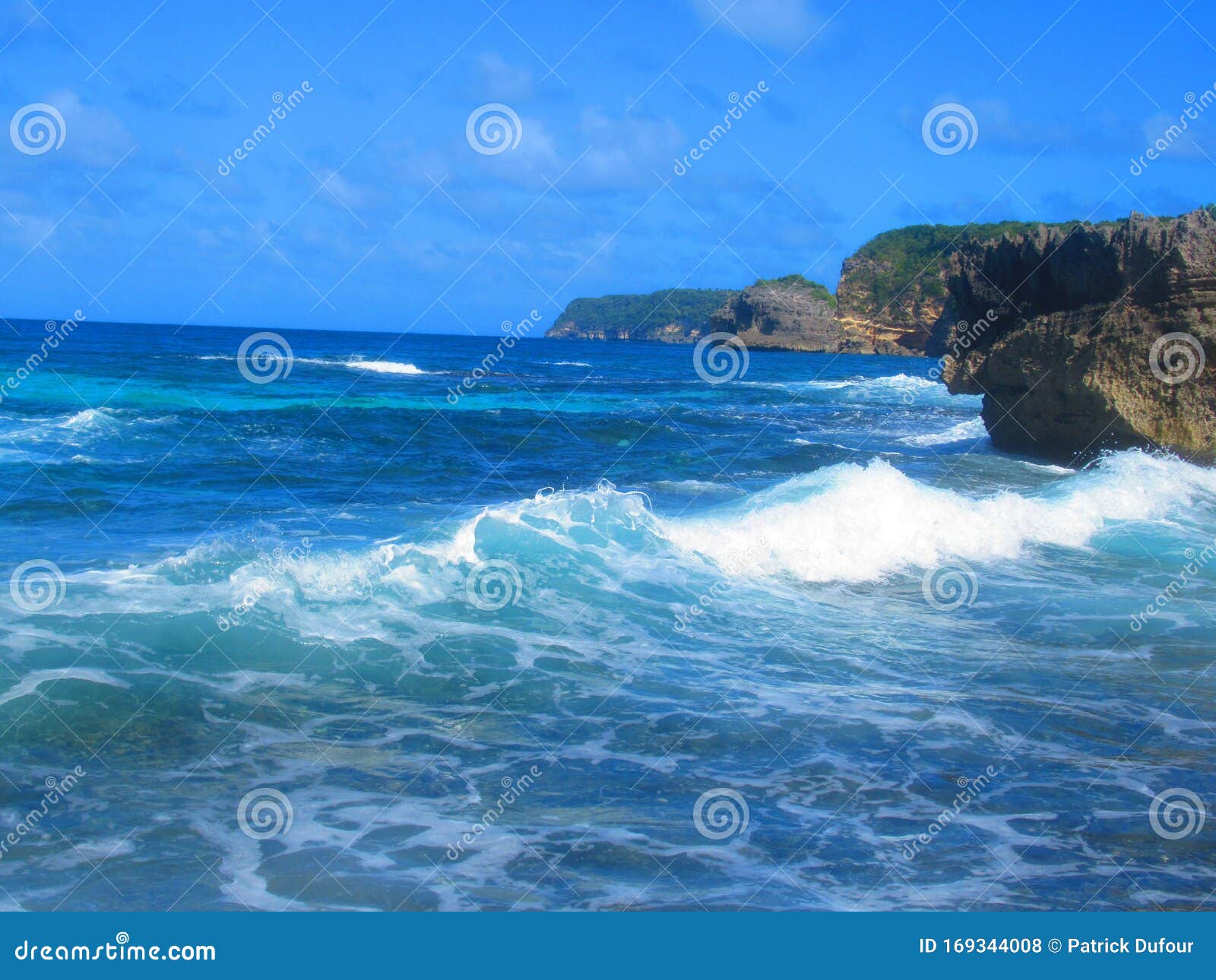 The Sea with Big Waves in Front of the Cliffs Stock Photo - Image of ...