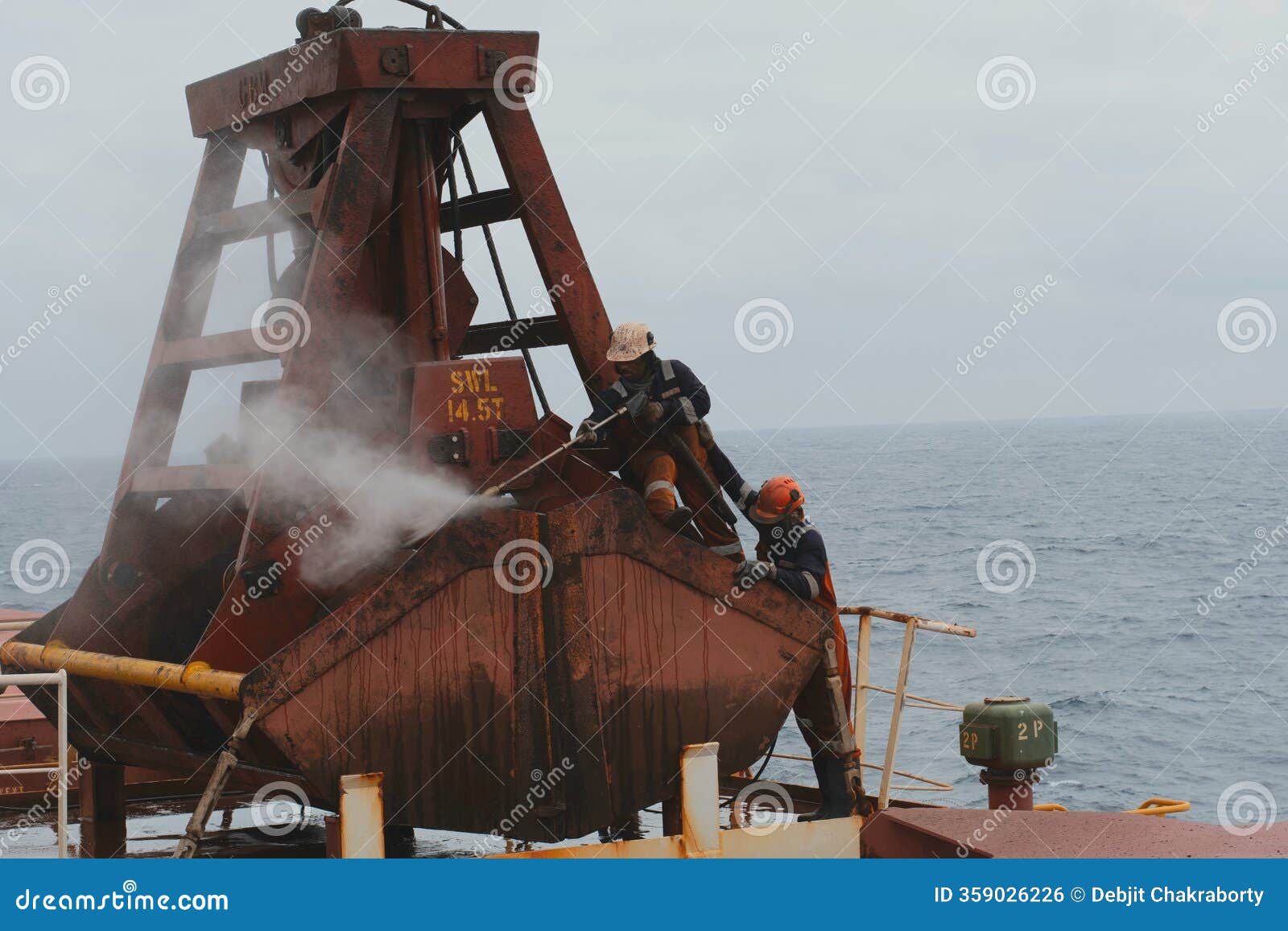 Derusting Process of Grab by Hydroblusting by Crew Members Editorial ...