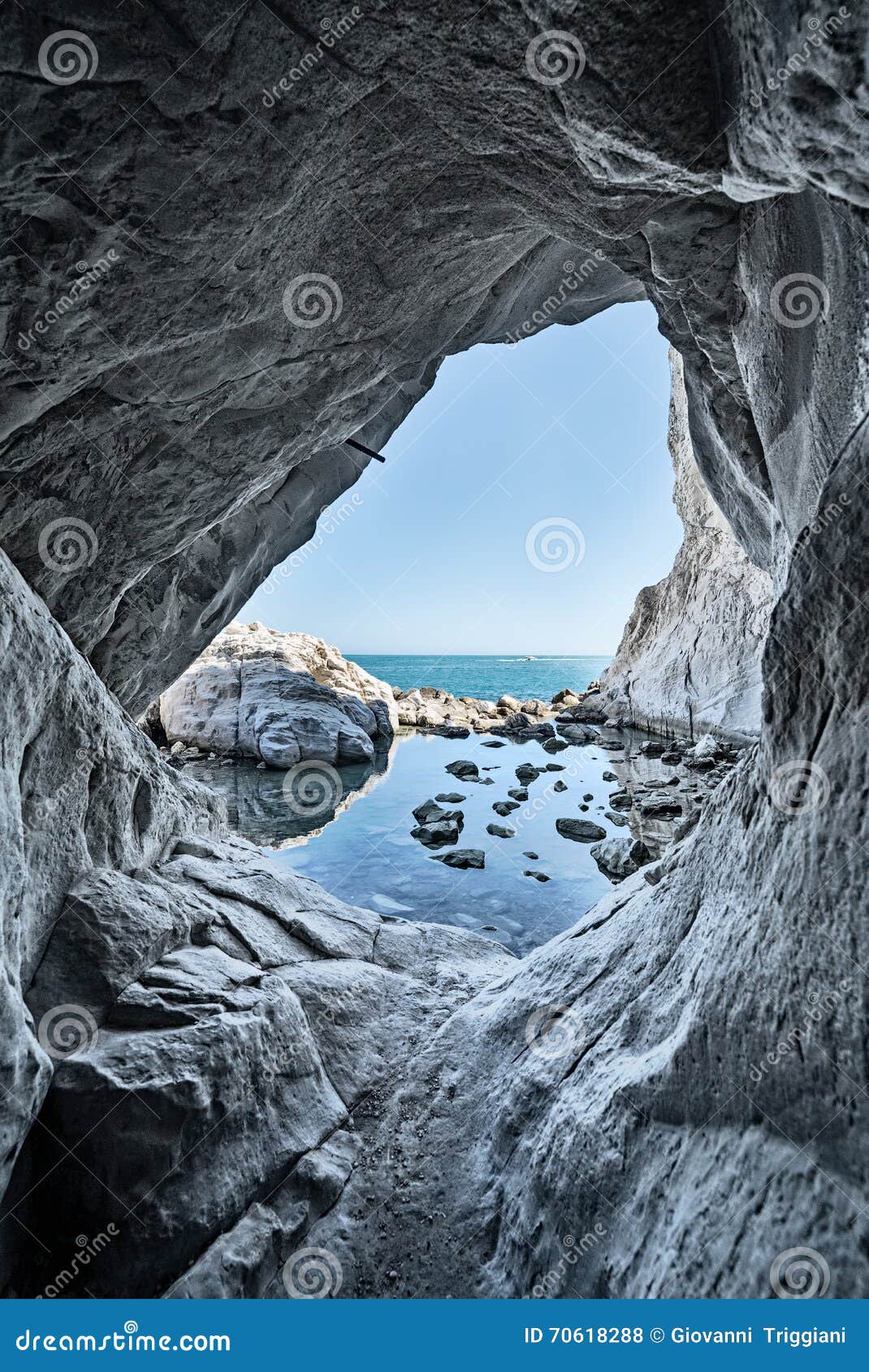 Sea Cave Rocks. Water Reflections Stock Photo - Image of cave, beach ...
