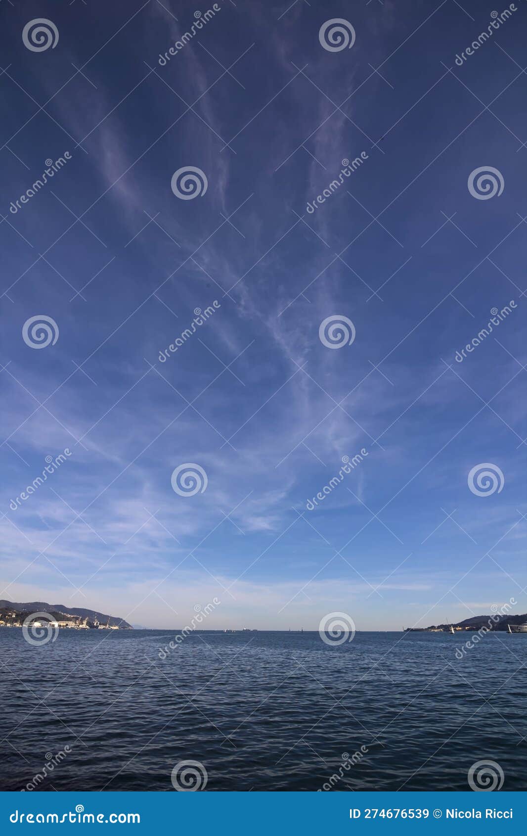 Sea and a Cliff in a Bay Seen from the Distance at Sunset Stock Image ...