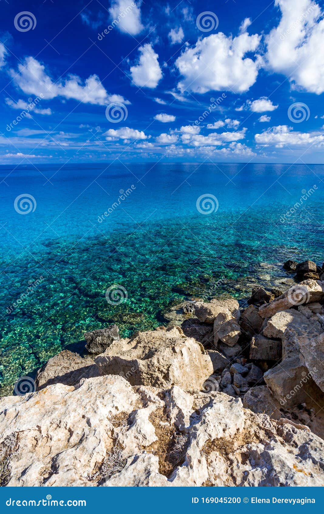 Sea Coast with Clear Turquoise Water and Sharp Stones, Blue Sky with ...