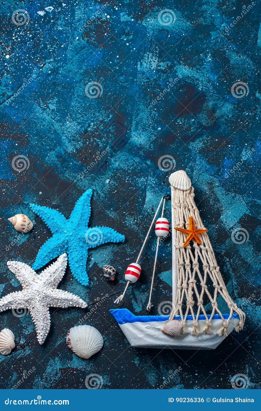 Sea Composition with a Boat and Seashells on a Dark Blue Background ...