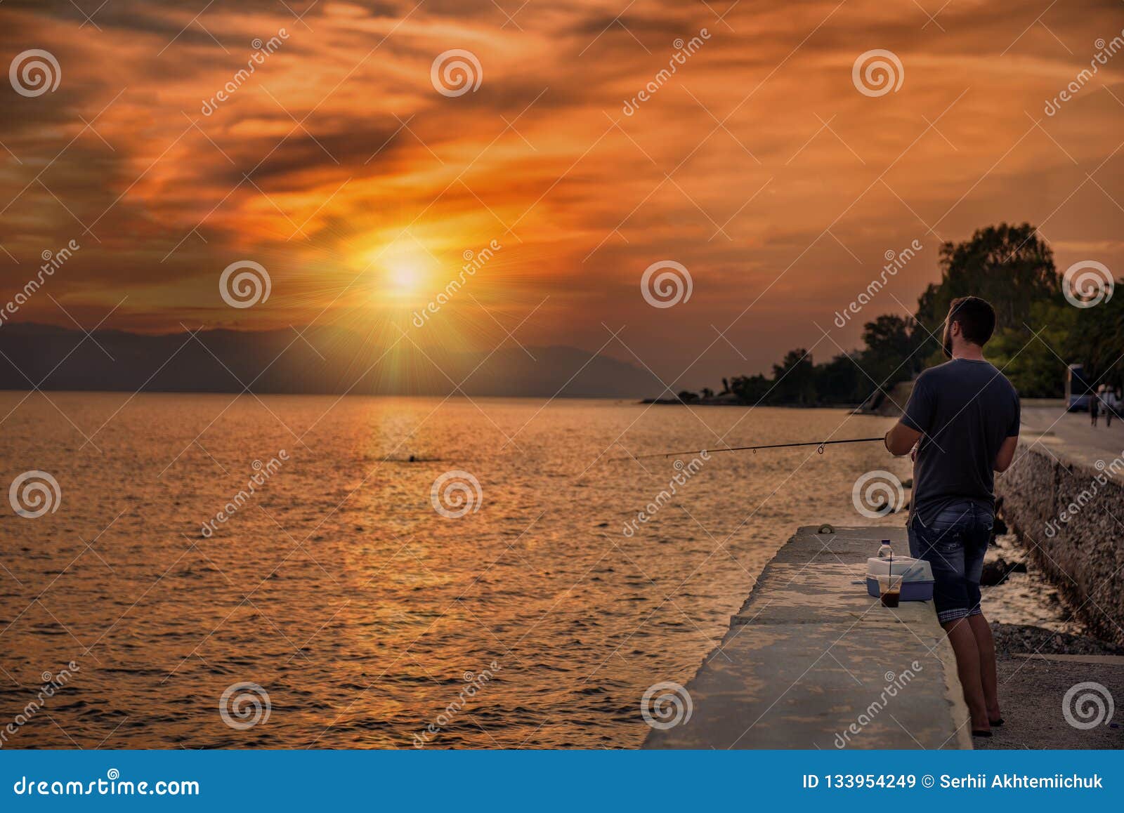 Sea fishing at sunset stock image. Image of recreation - 133954249