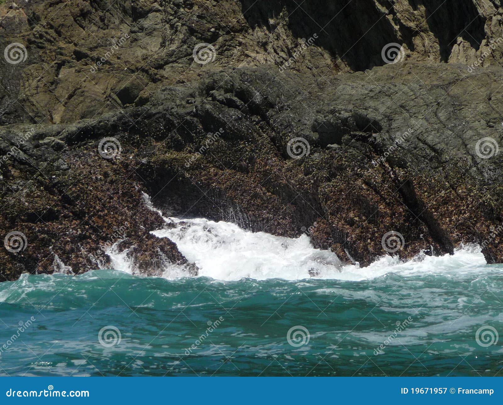 Sea foam on rocks stock image. Image of nature, waves - 19671957