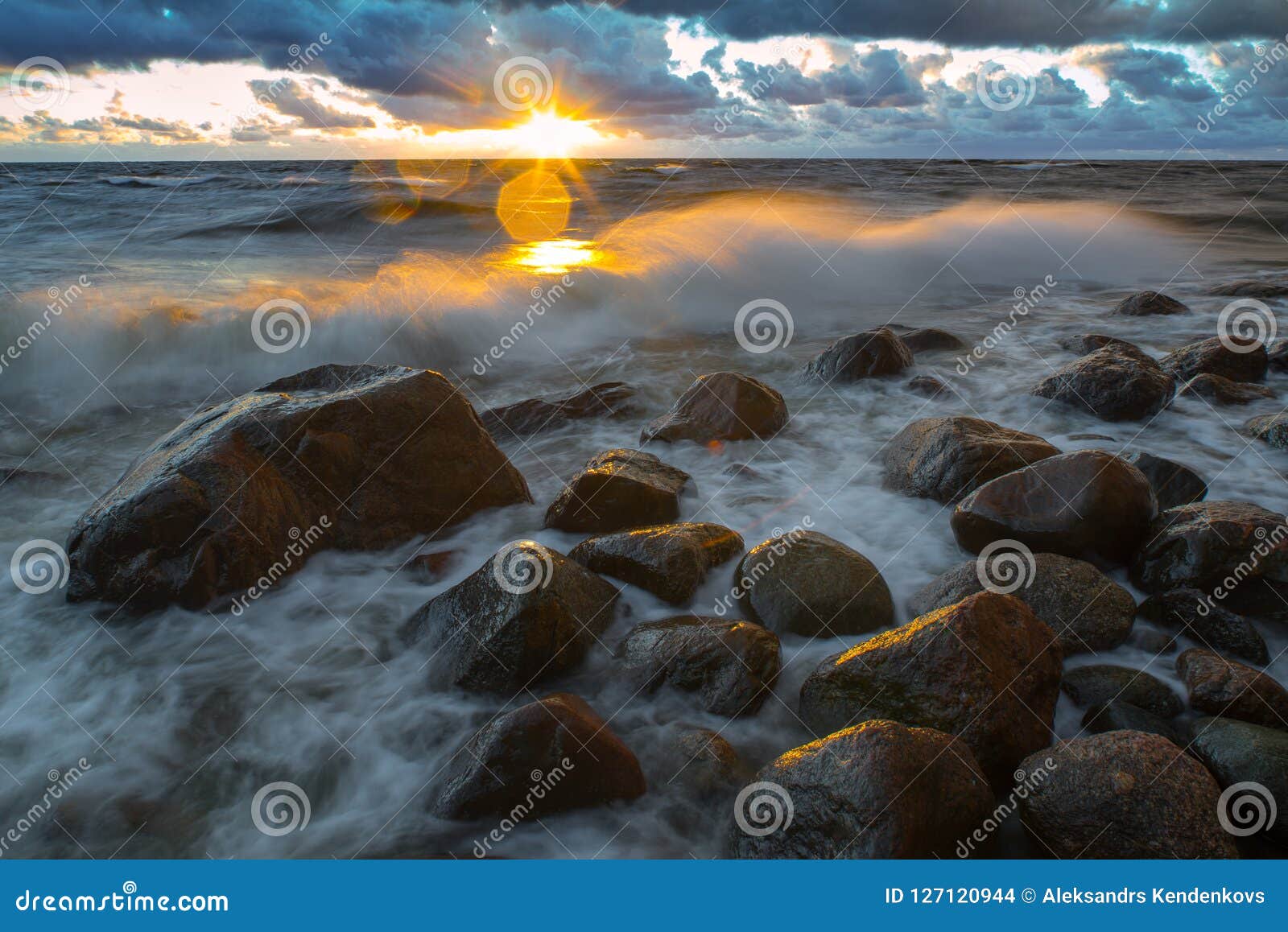 A Sea Landscape with Rocks, a Storm and a Setting Sun. Waves, Rocks ...