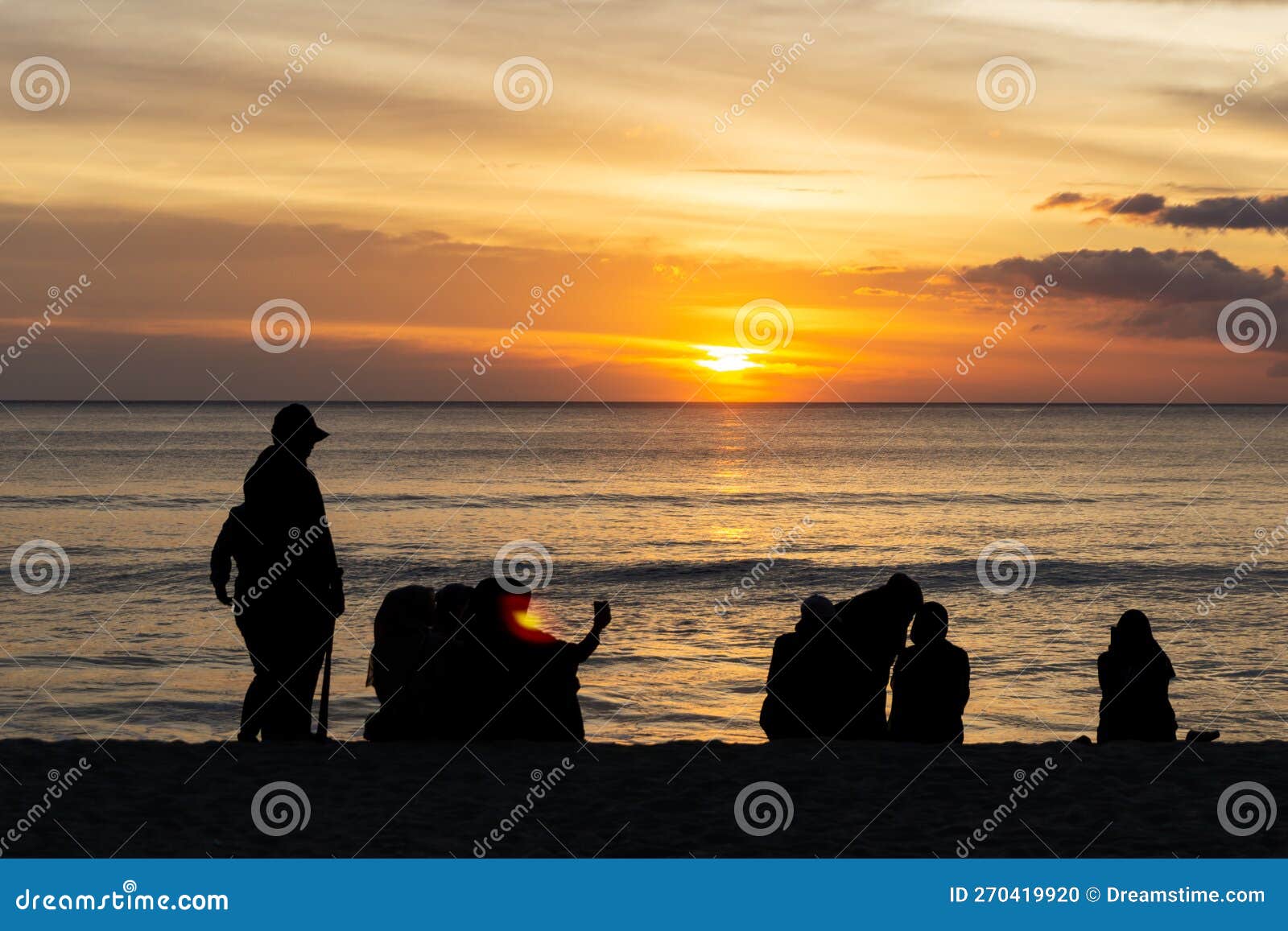 Sea Landscape at Sunset. Group of People Enjoying Sunset View at the ...