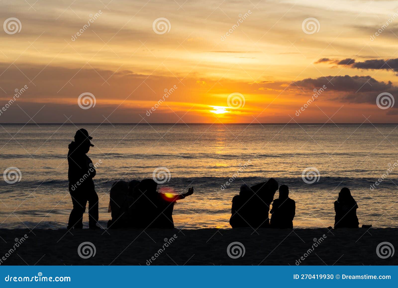 Sea Landscape at Sunset. Group of People Enjoying Sunset View at the ...