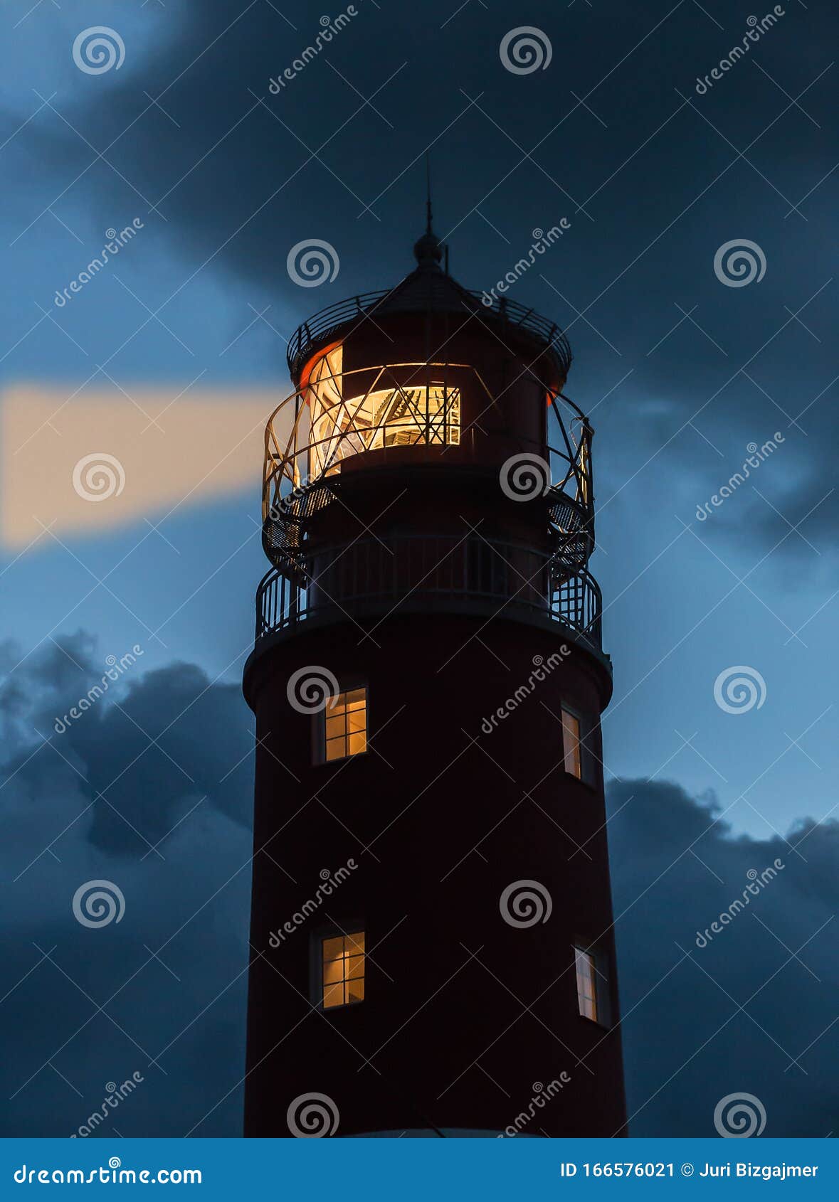 Sea Lighthouse with a Ray of Light at Night Stock Image - Image of ...