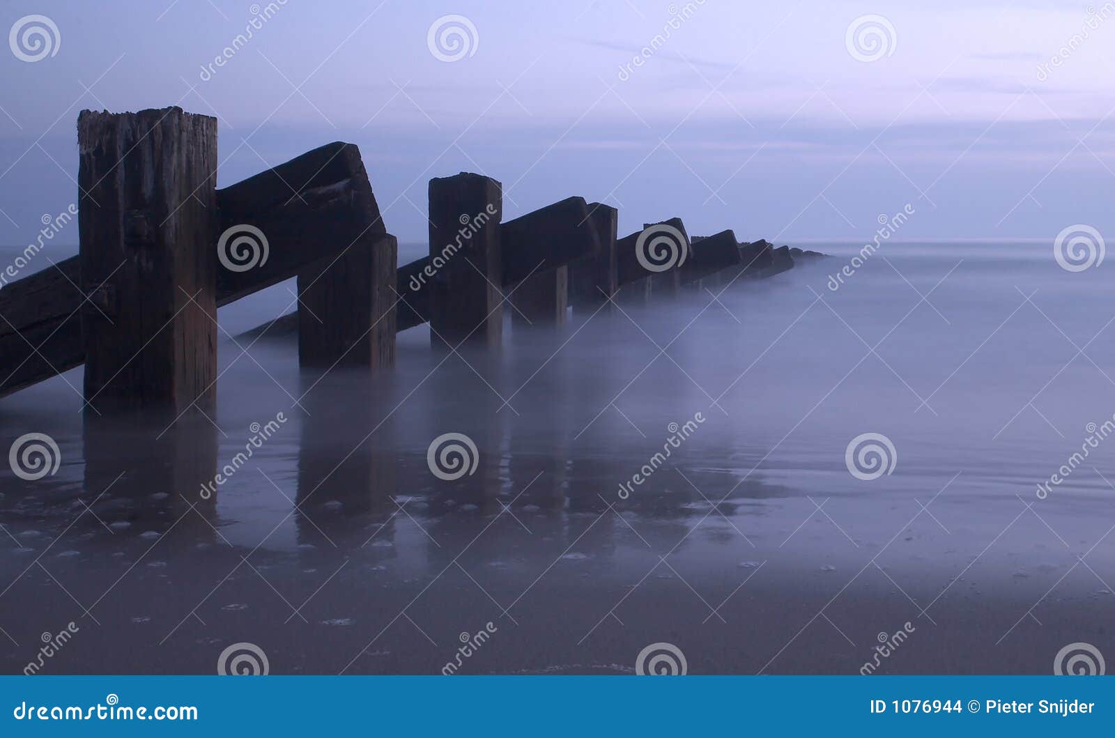Sea, poles and sunset stock photo. Image of cloud, ocean - 1076944