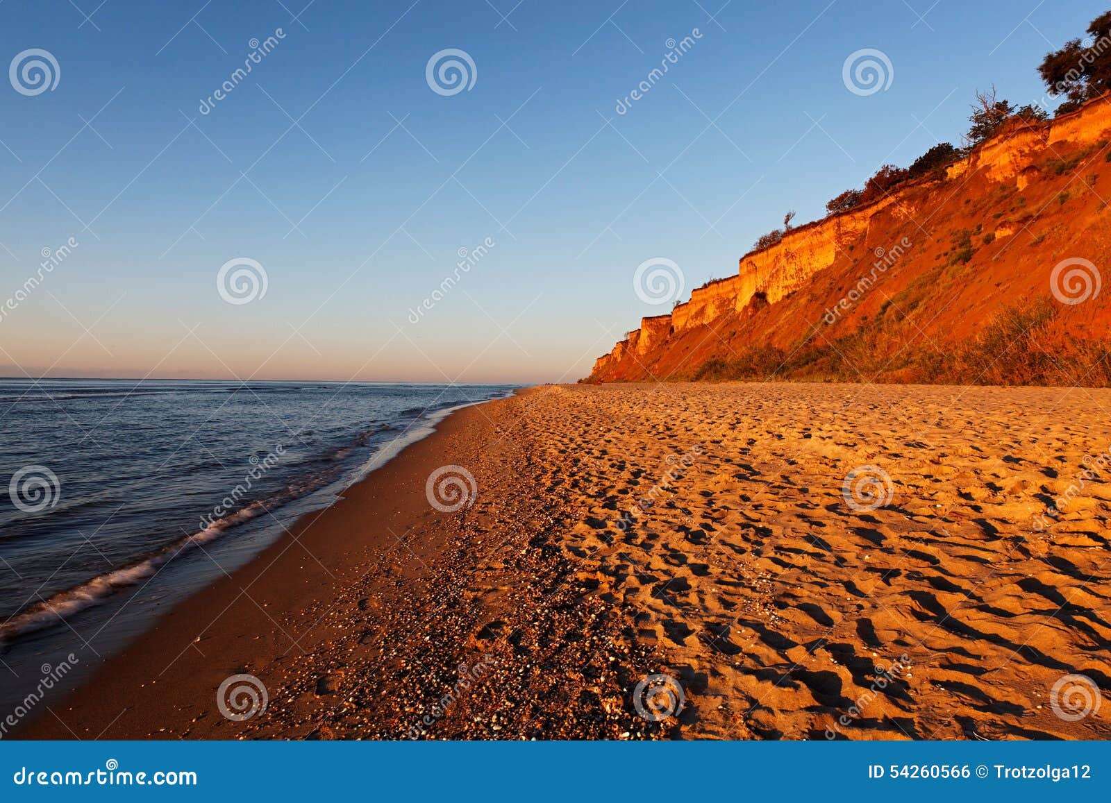 Sea with a Sandy Beach and Sky in the Rays of the Rising Sun Stock ...