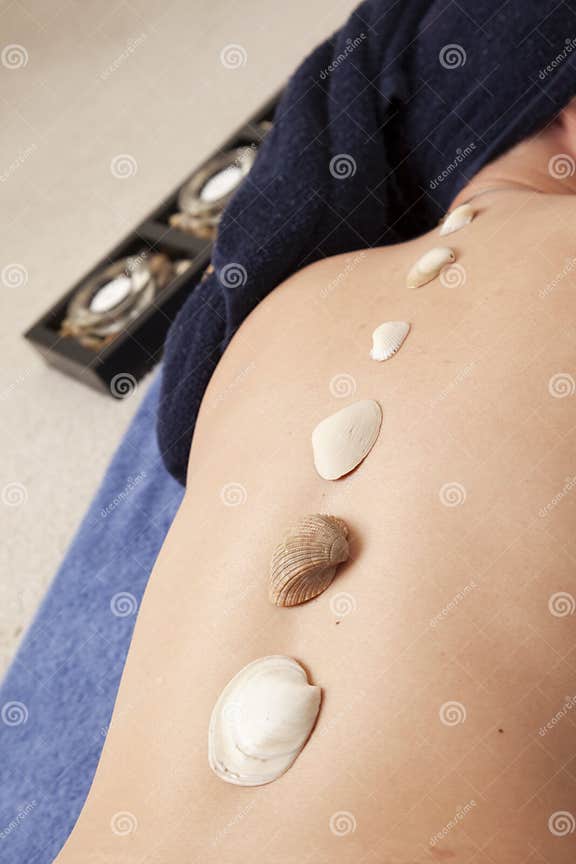 Sea shell massage stock image. Image of candle, middle - 8577855