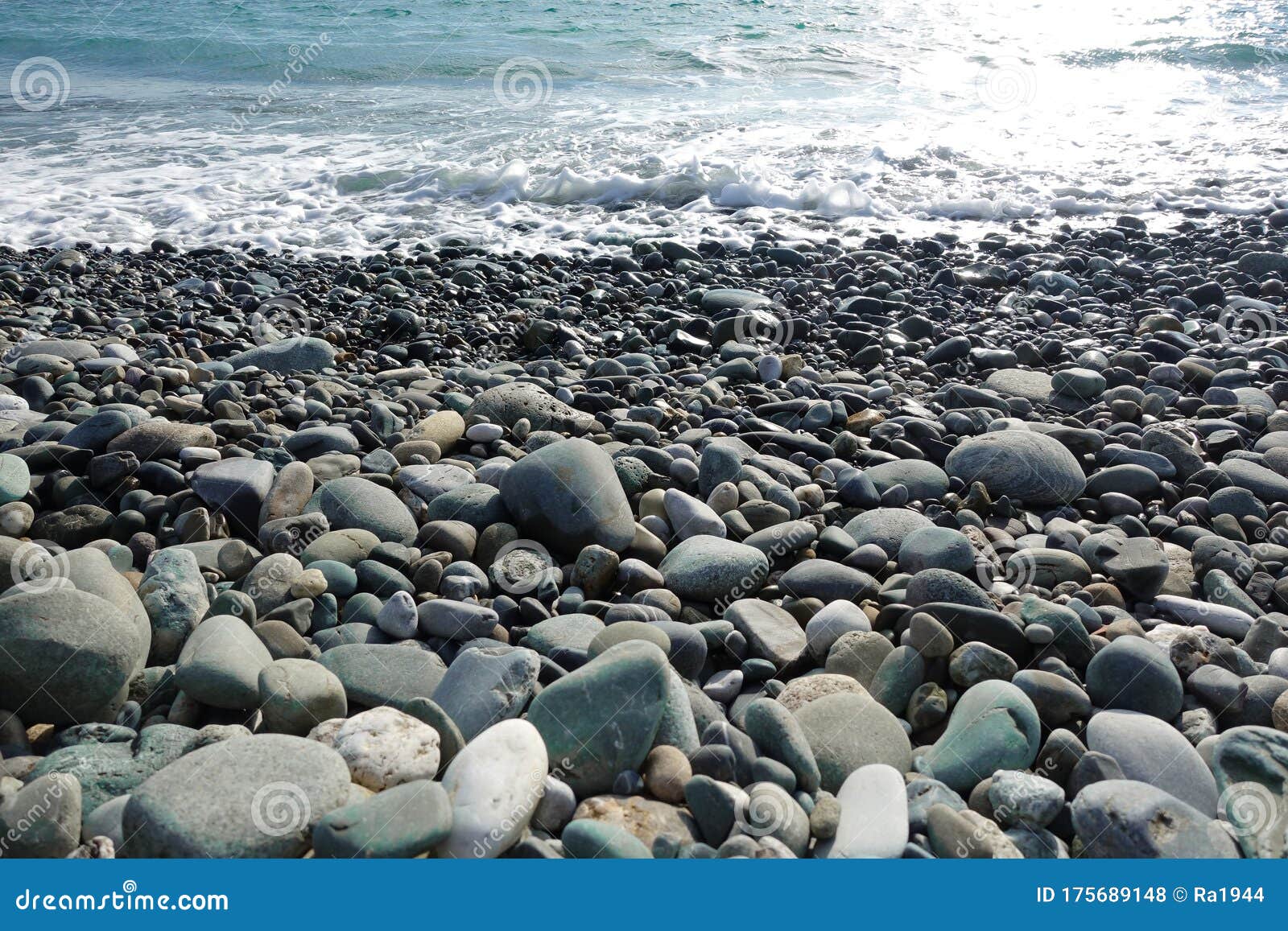 Sea Shore with Pebbles. Wet Sea Pebbles on the Beach and Quiet Sea Surf ...