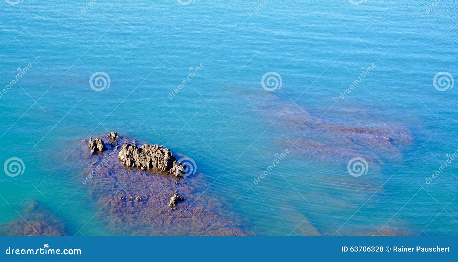 Sea with some rocks stock photo. Image of summer, cliff - 63706328