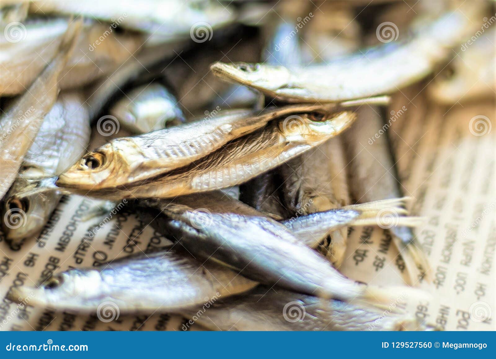 Sea Sprat Small Fish Close Up on a Newspaper, Selective Focus. Stock ...