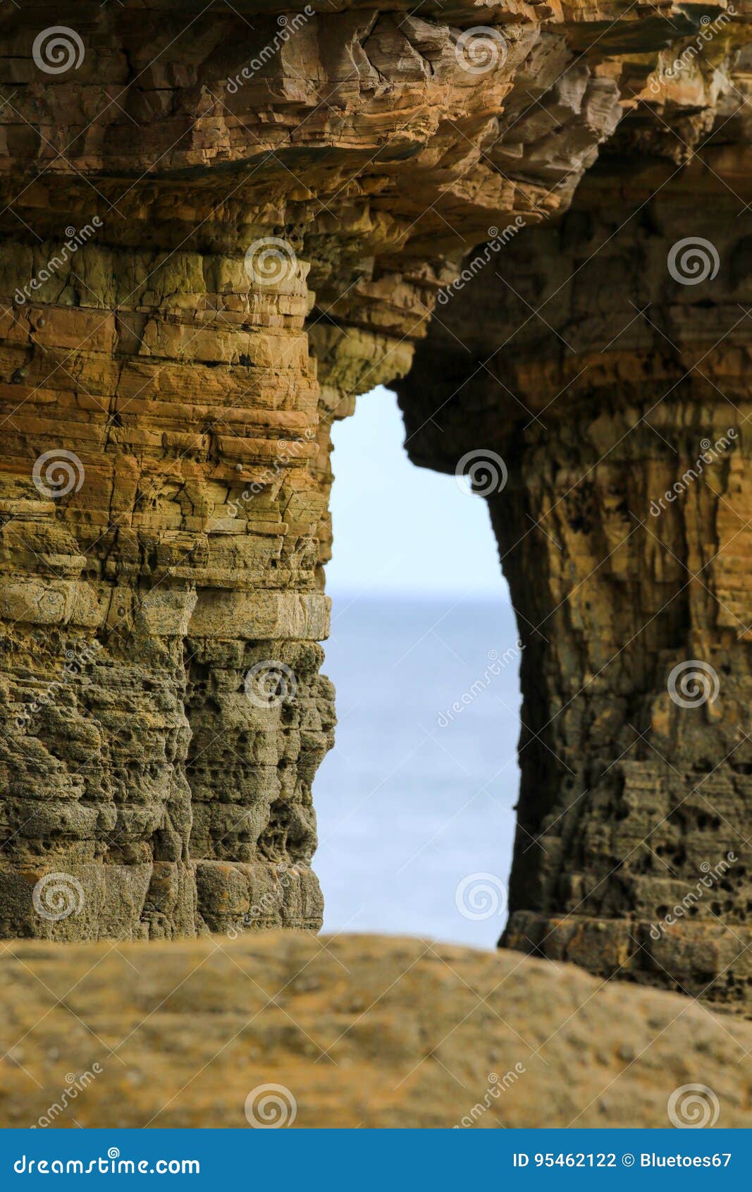 Sea stack on the beach stock photo. Image of hole, fine - 95462122
