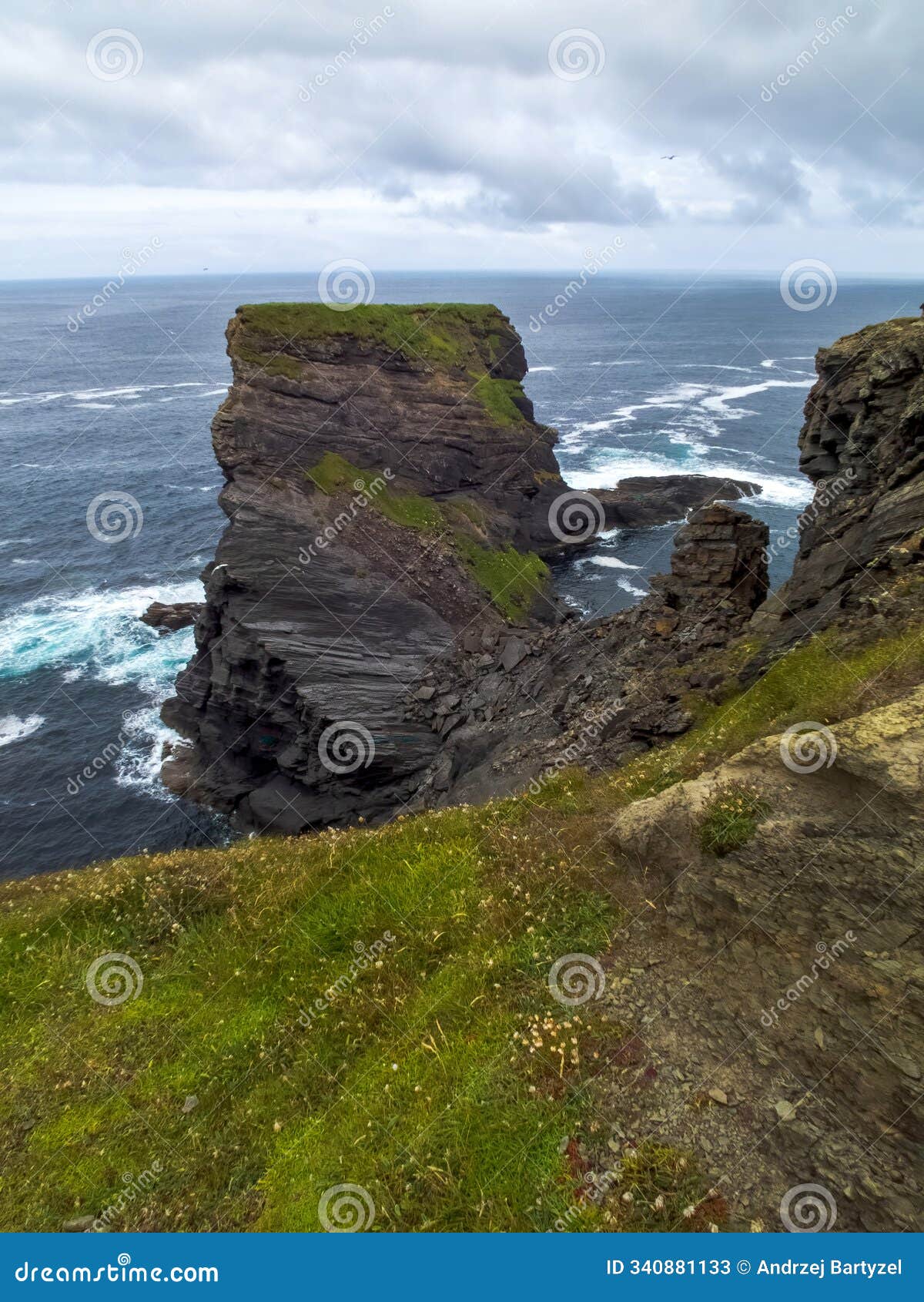 Sea stack by Kilkee Cliffs stock image. Image of island - 340881133