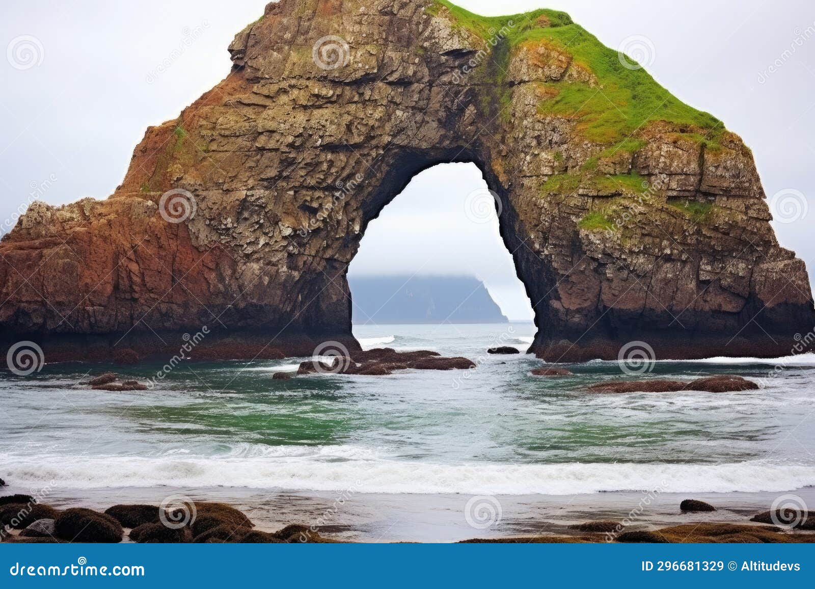 A Sea-stack Rock Formation Pierced by Tunnels Stock Image - Image of ...