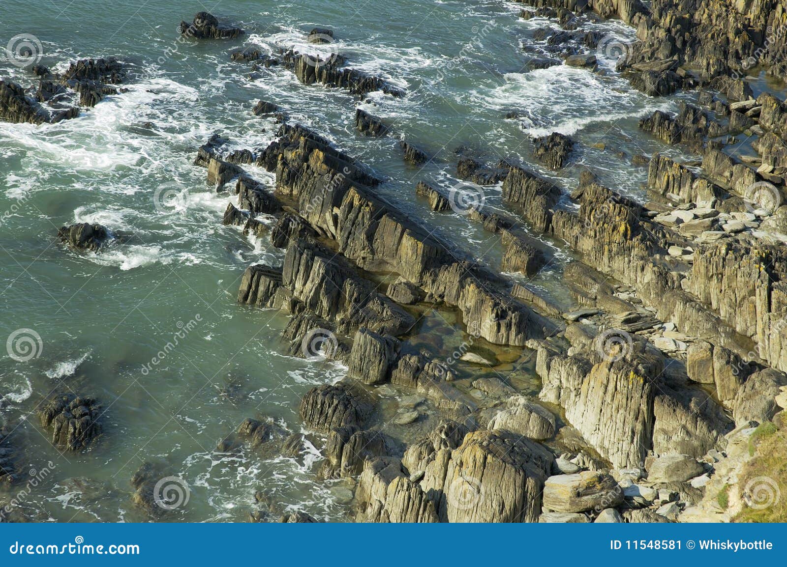 Sea on Vertical Rock Strata Stock Image - Image of north, rocks: 11548581