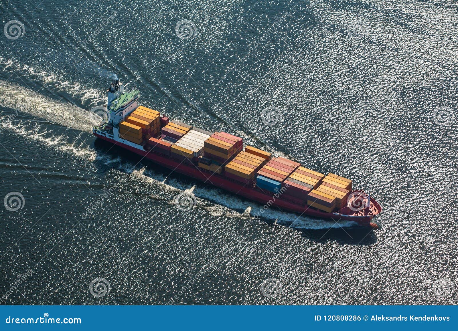 A Sea Vessel is a Container Ship at Full Speed in the Open Sea. View ...