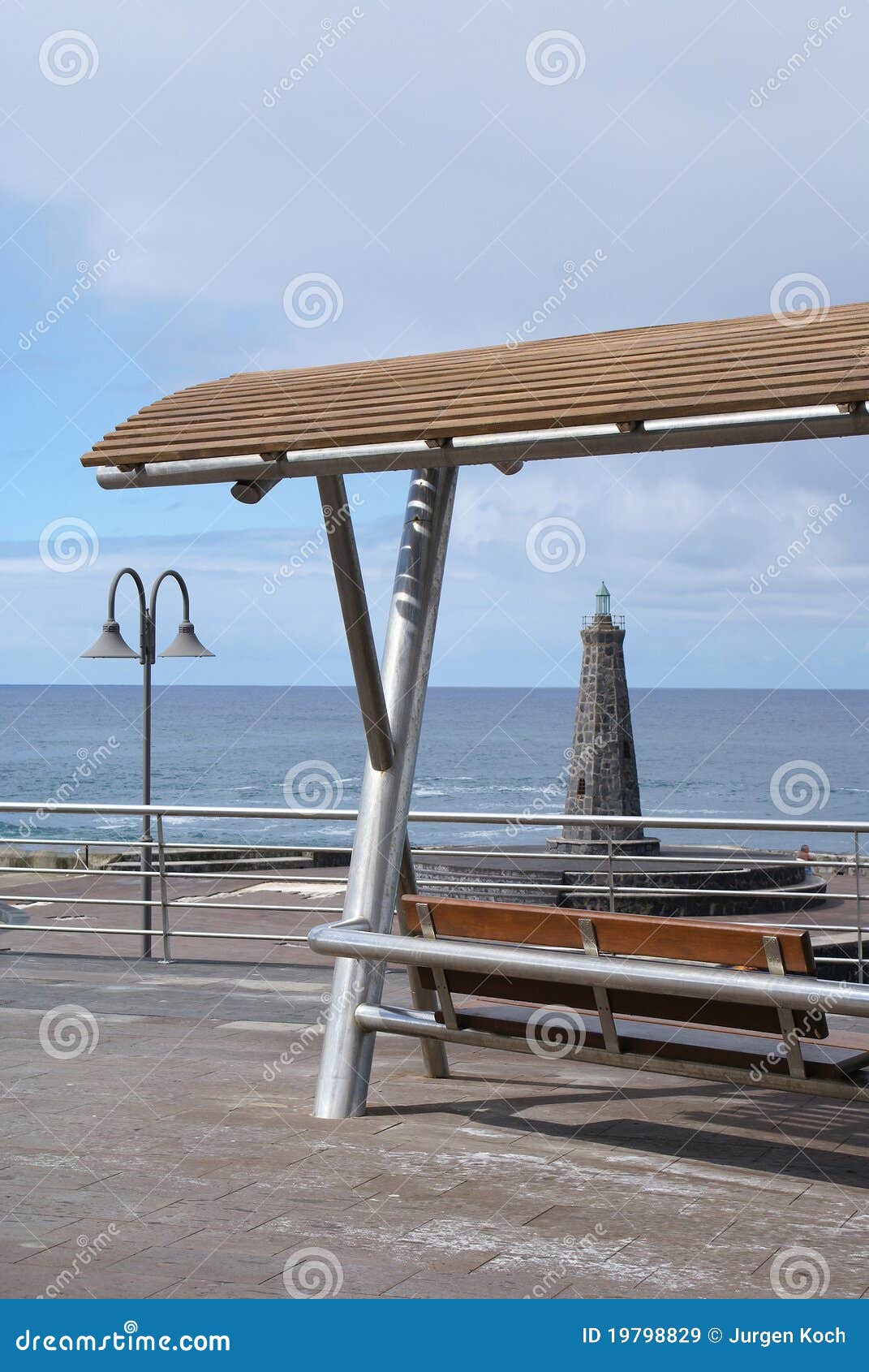 Sea View with Bench and Small Lighthouse Stock Image - Image of ...